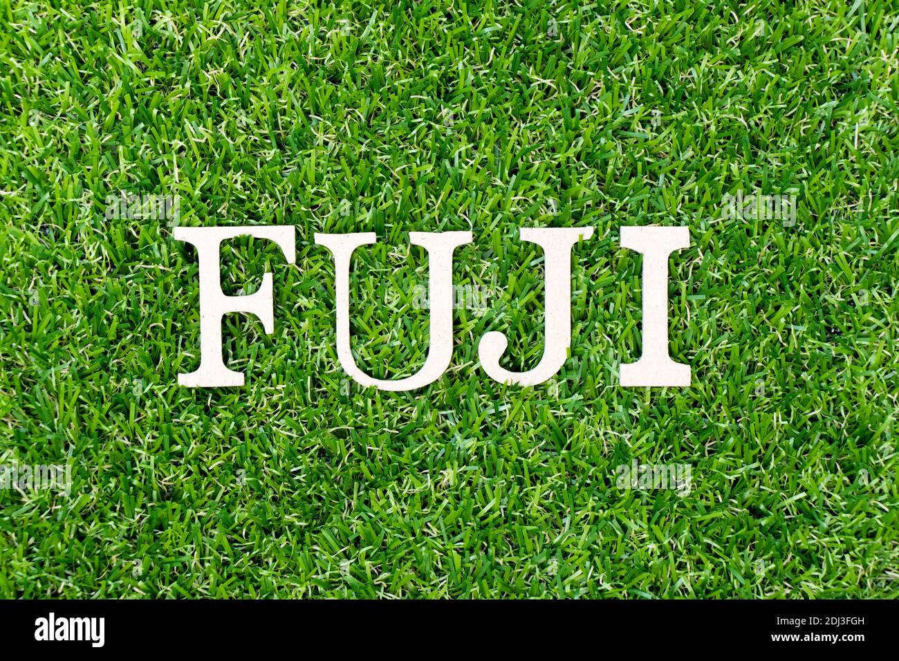 Wood letter in word fuji on green grass background Stock Photo - Alamy