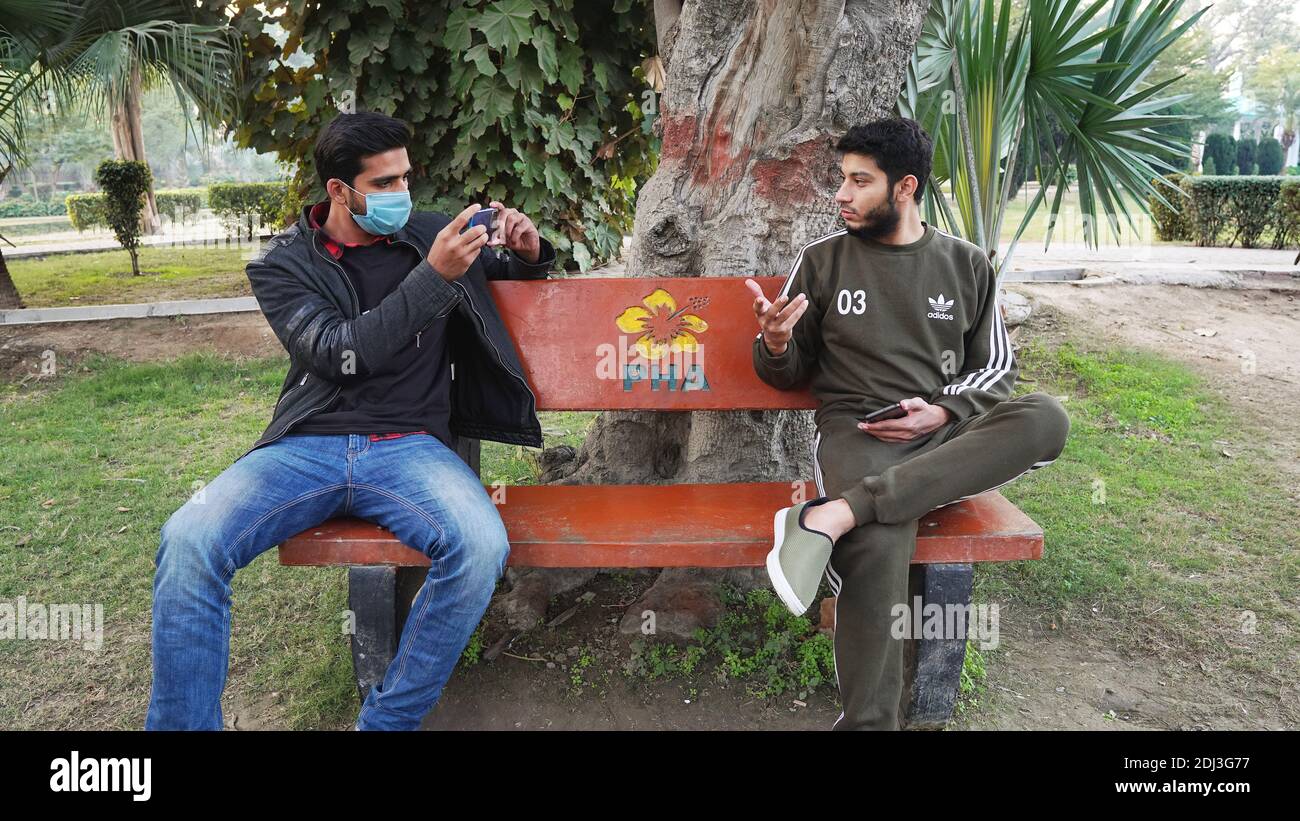 Person Taking Photo of Other Person Sitting Next to him for not wearing ...