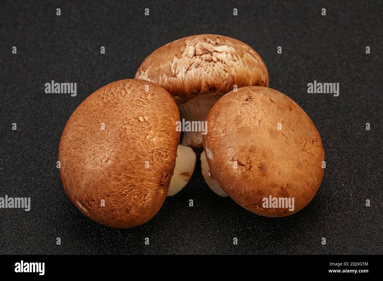 Tasty Raw Brown Champignons over background Stock Photo - Alamy