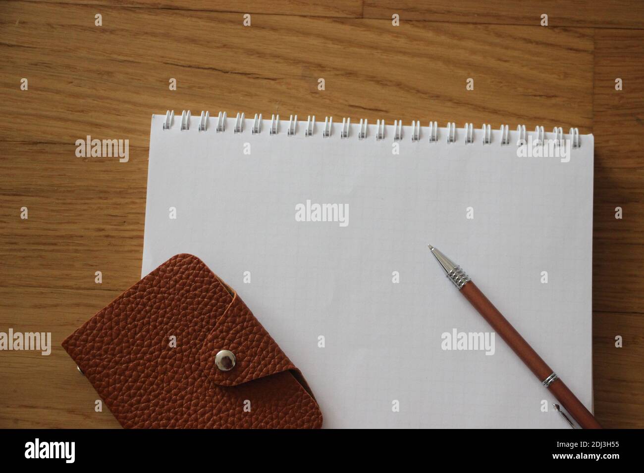 Office desk table with pen, notebook, wallet. Top view with copy space ...