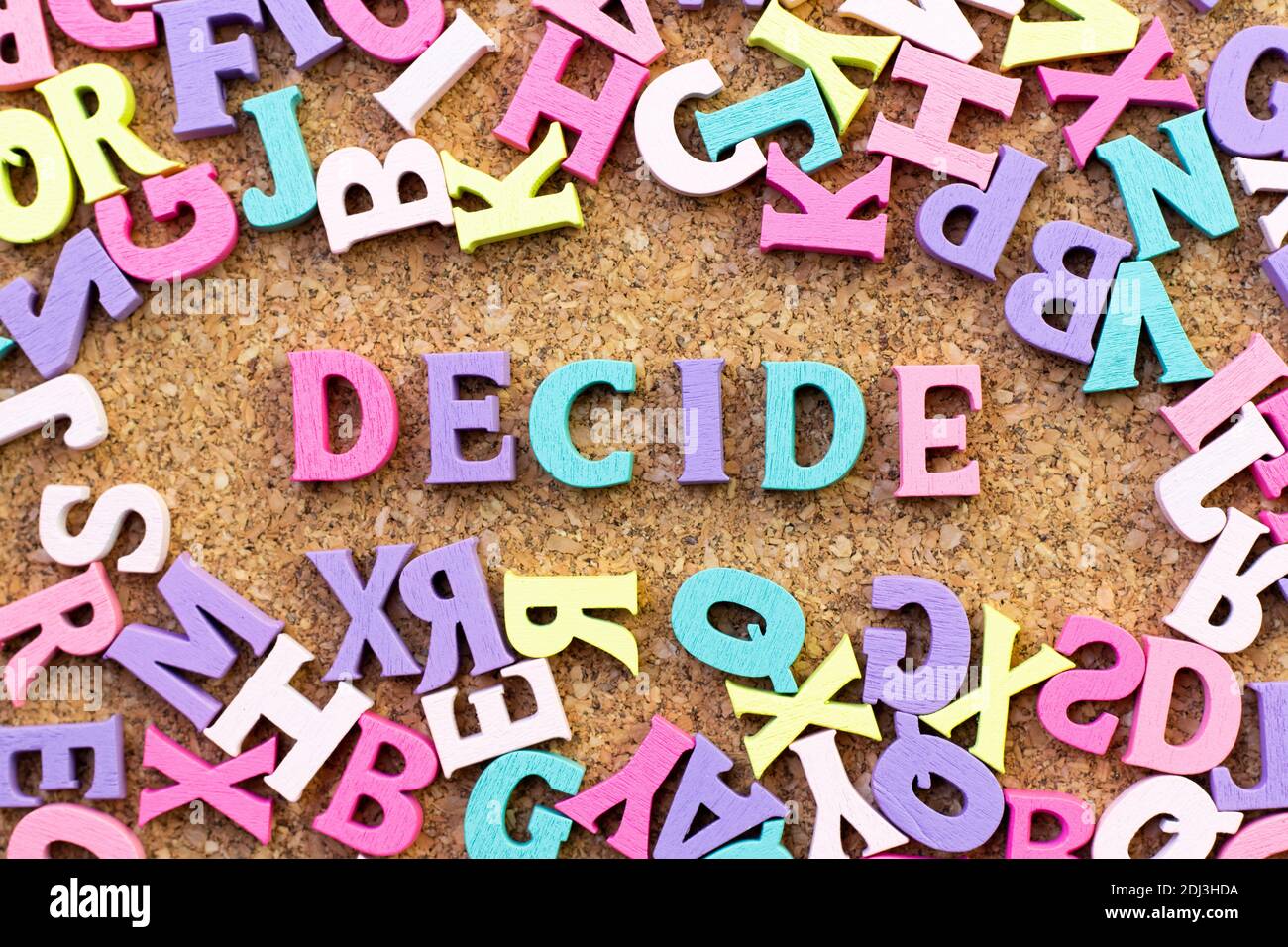 Color alphabet in word decide with another letter as frame on cork ...