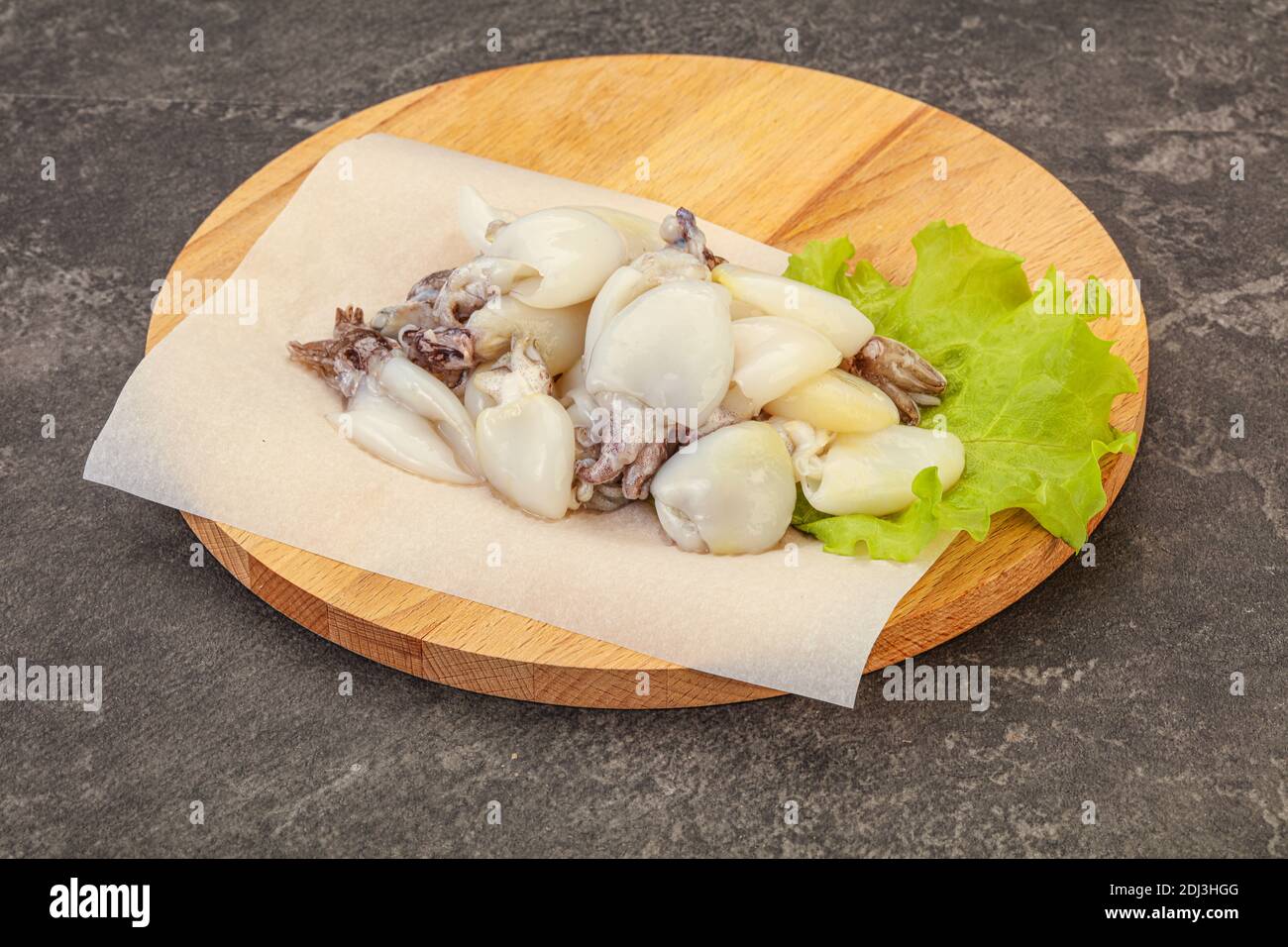 Raw seafood - cuttlefish for cooking over board Stock Photo - Alamy