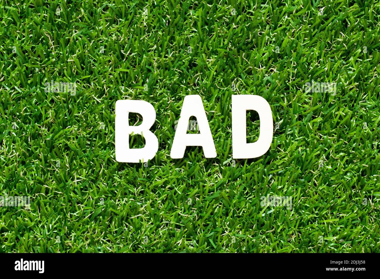 Wood alphabet letter in word bad on green grass background Stock Photo ...