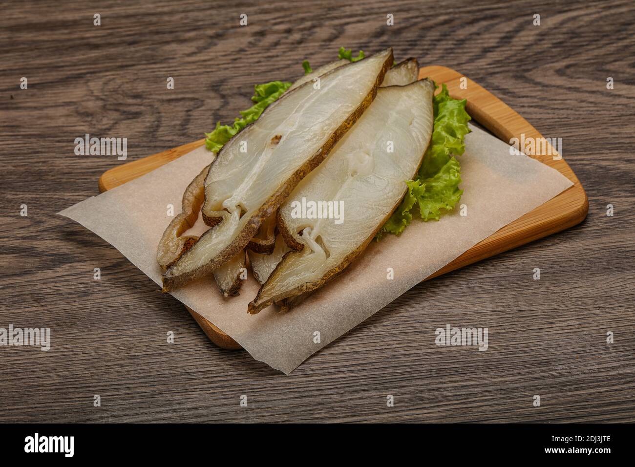 Delicous smoked halibut fish slices snack Stock Photo - Alamy