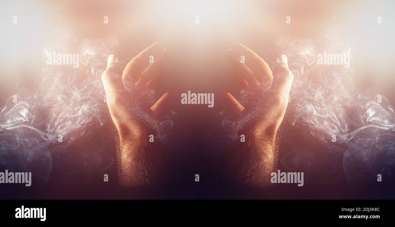 hand in smoke ona black background, praying hands Stock Photo - Alamy
