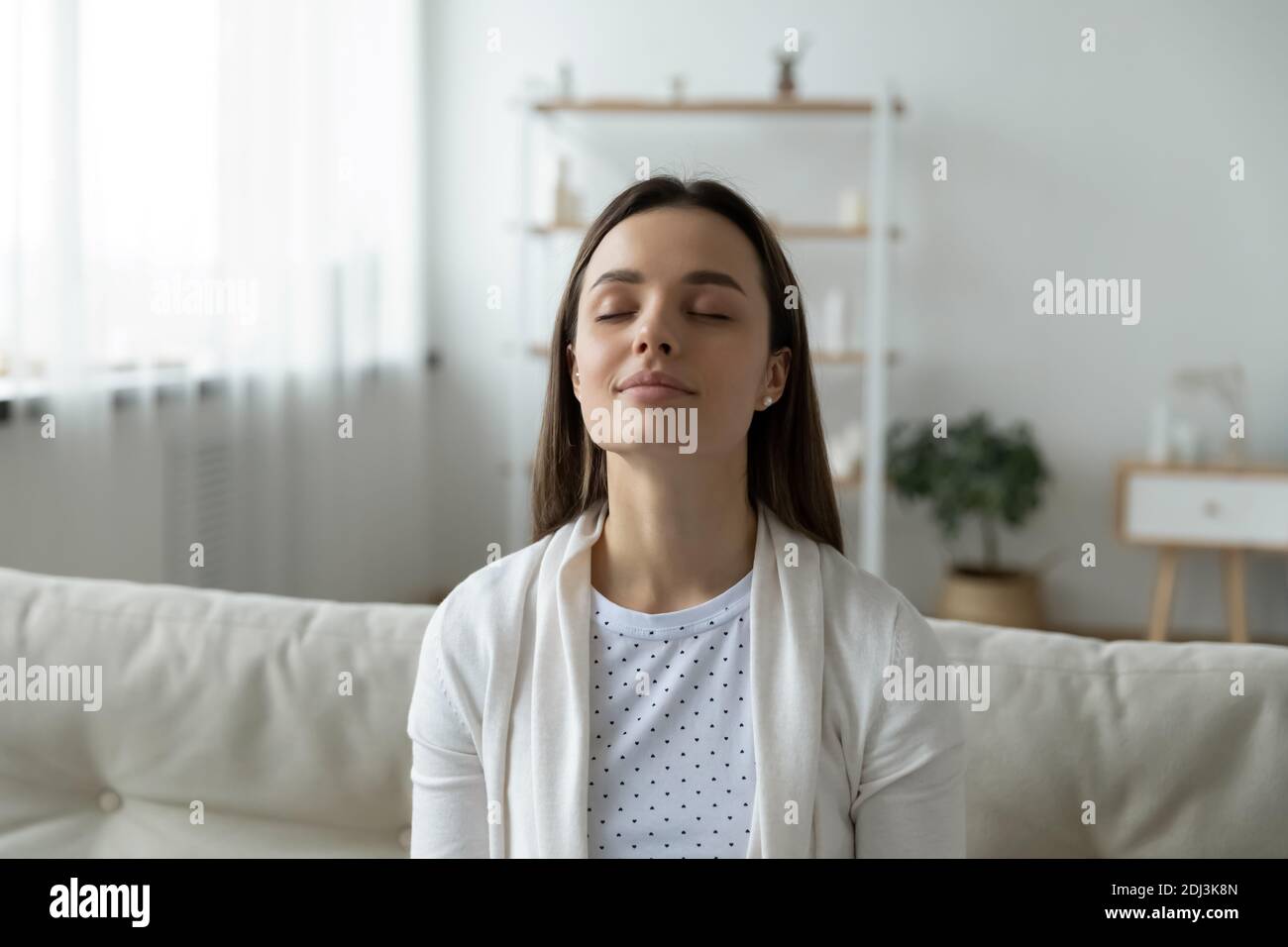 Close up calm young woman relaxing with closed eyes Stock Photo - Alamy