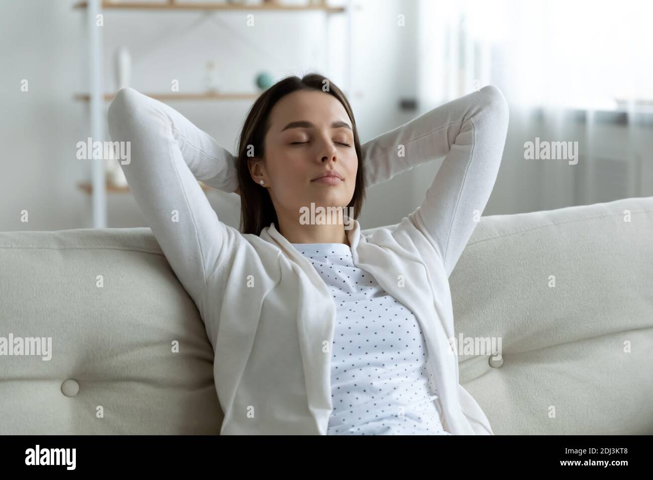 Close up peaceful young woman with hands behind head relaxing Stock ...