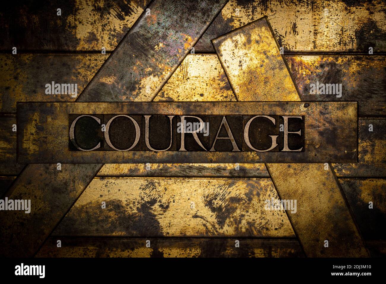 Courage text on vintage textured bronze grunge copper and gold ...