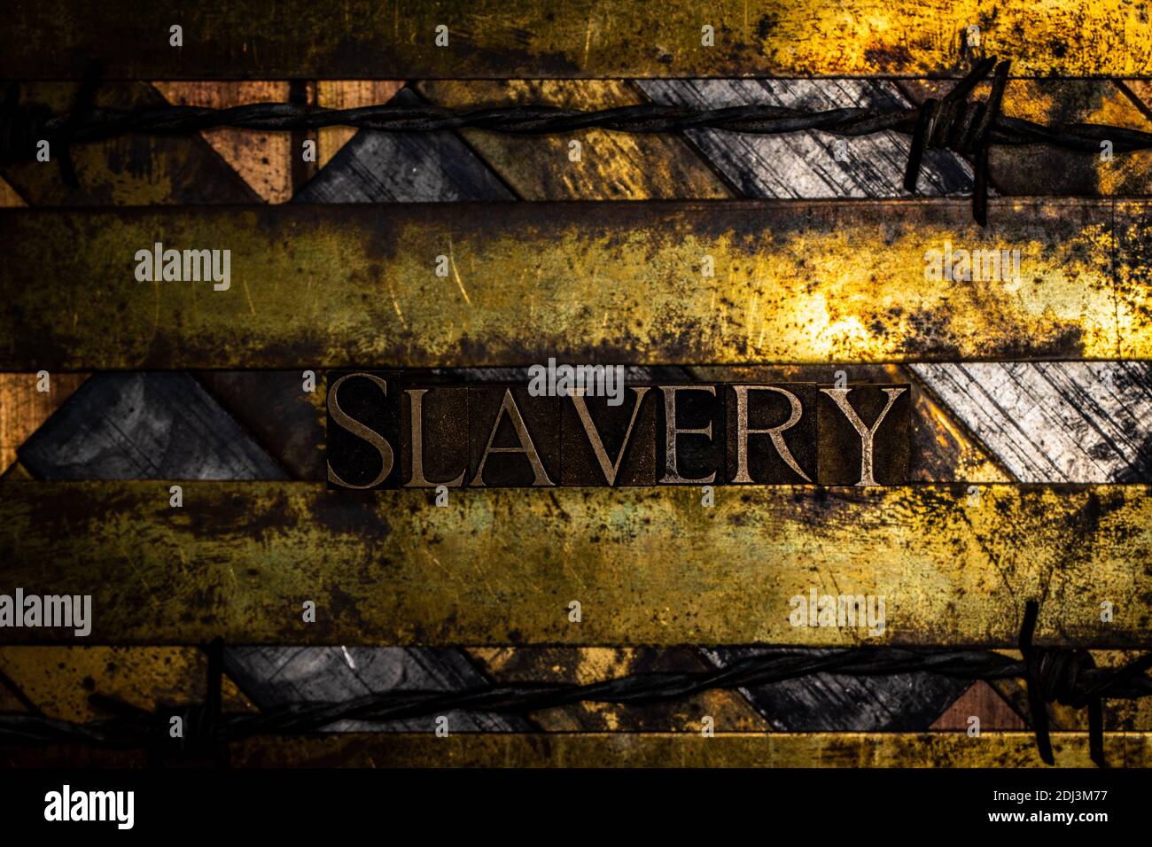 Slavery text on vintage textured grunge copper and gold background ...