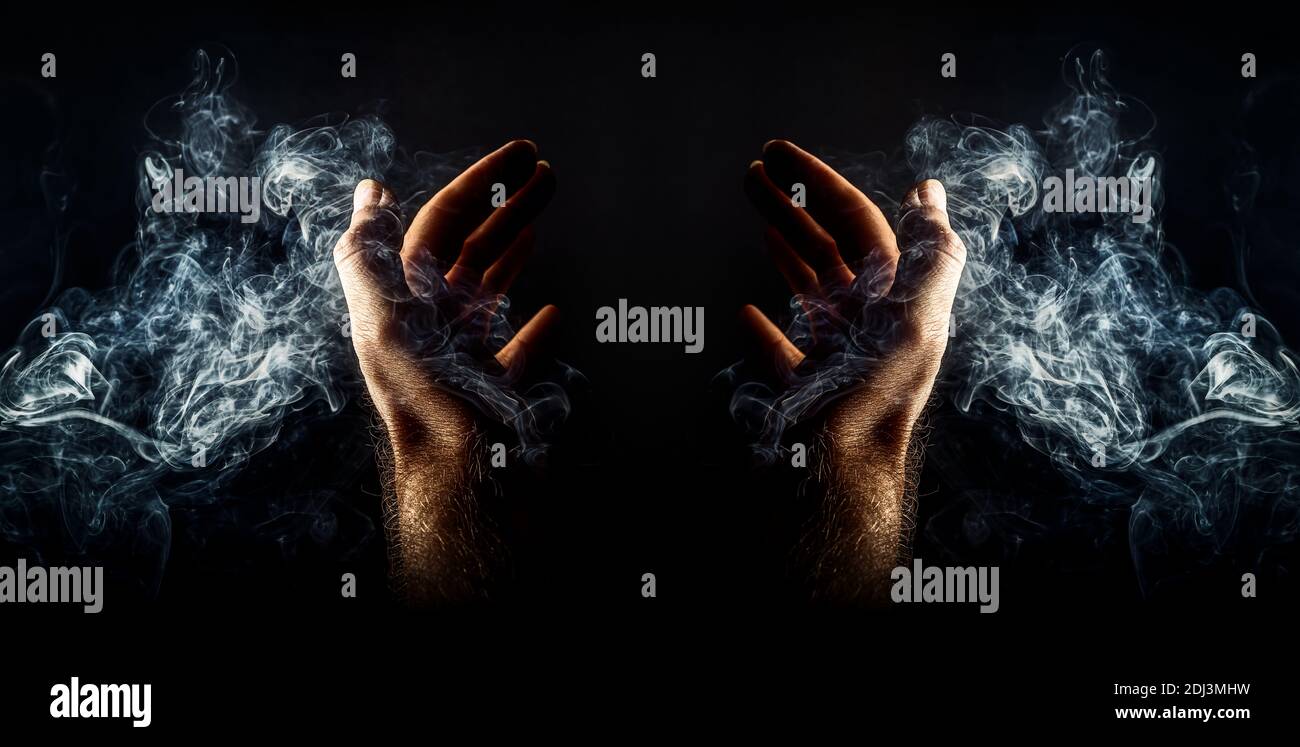 hand in smoke ona black background, praying hands Stock Photo - Alamy