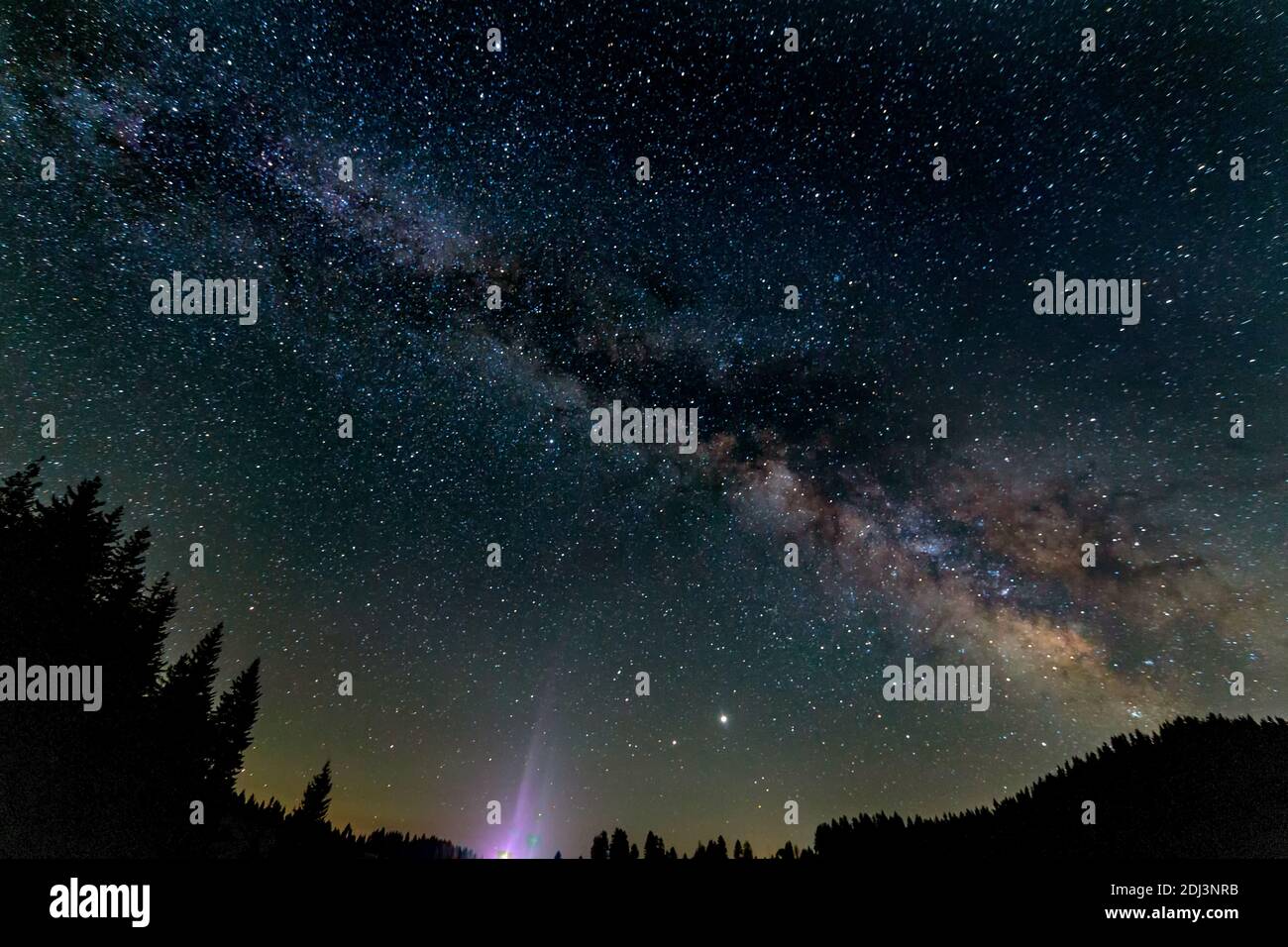 Beam of light pointing at the Milky way galaxy. UFO singal concept ...