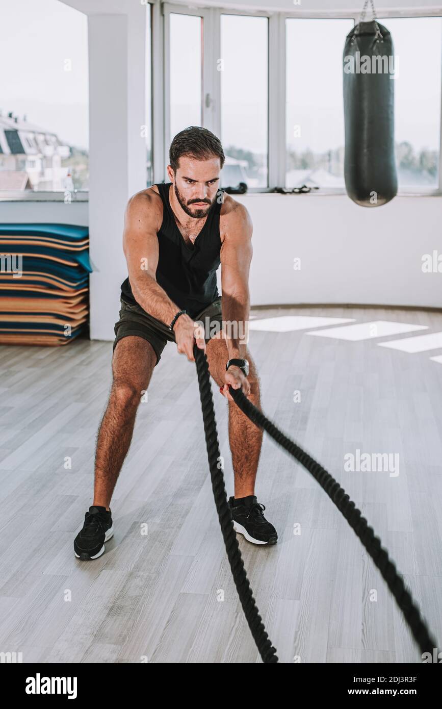 Man working out in gym, fitness time Stock Photo - Alamy