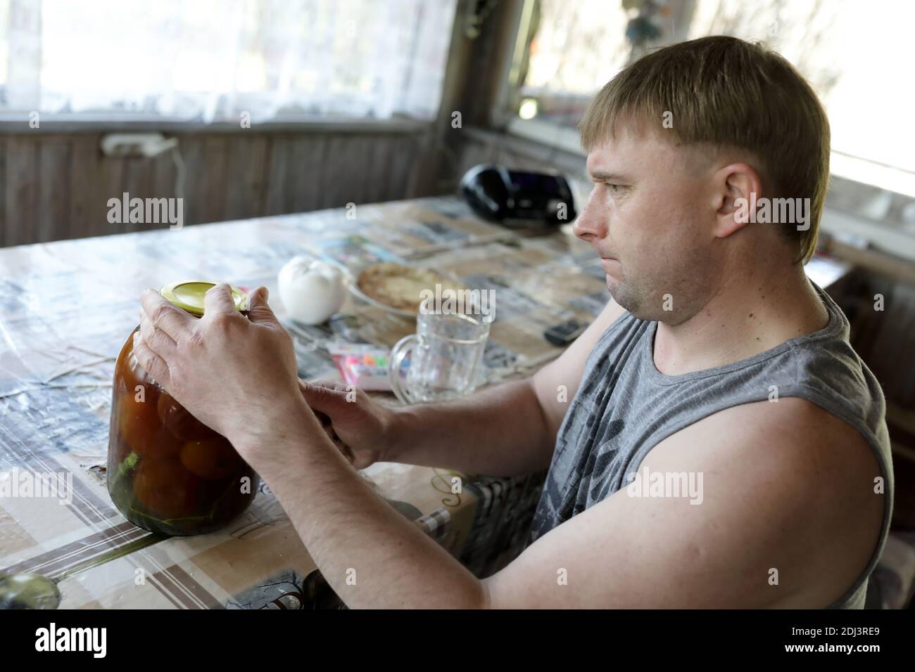 Man opening jar hi-res stock photography and images - Alamy