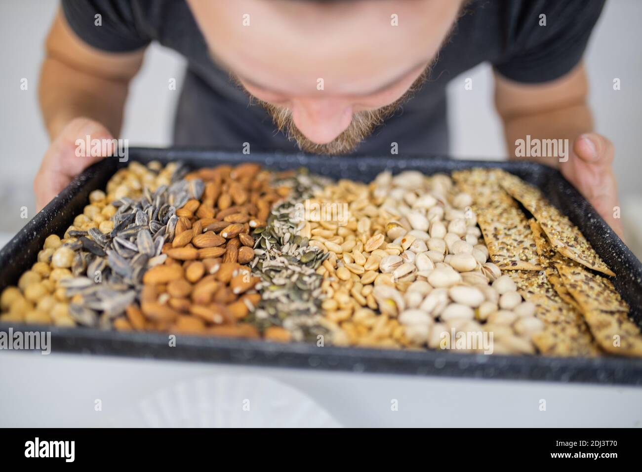 Black tray nuts seeds hi-res stock photography and images - Alamy