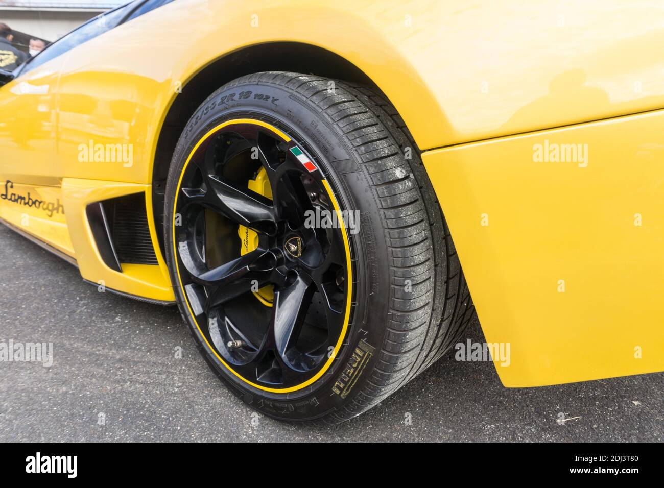 Close up detail of the gloss black Hercules alloy wheel rim on a yellow ...