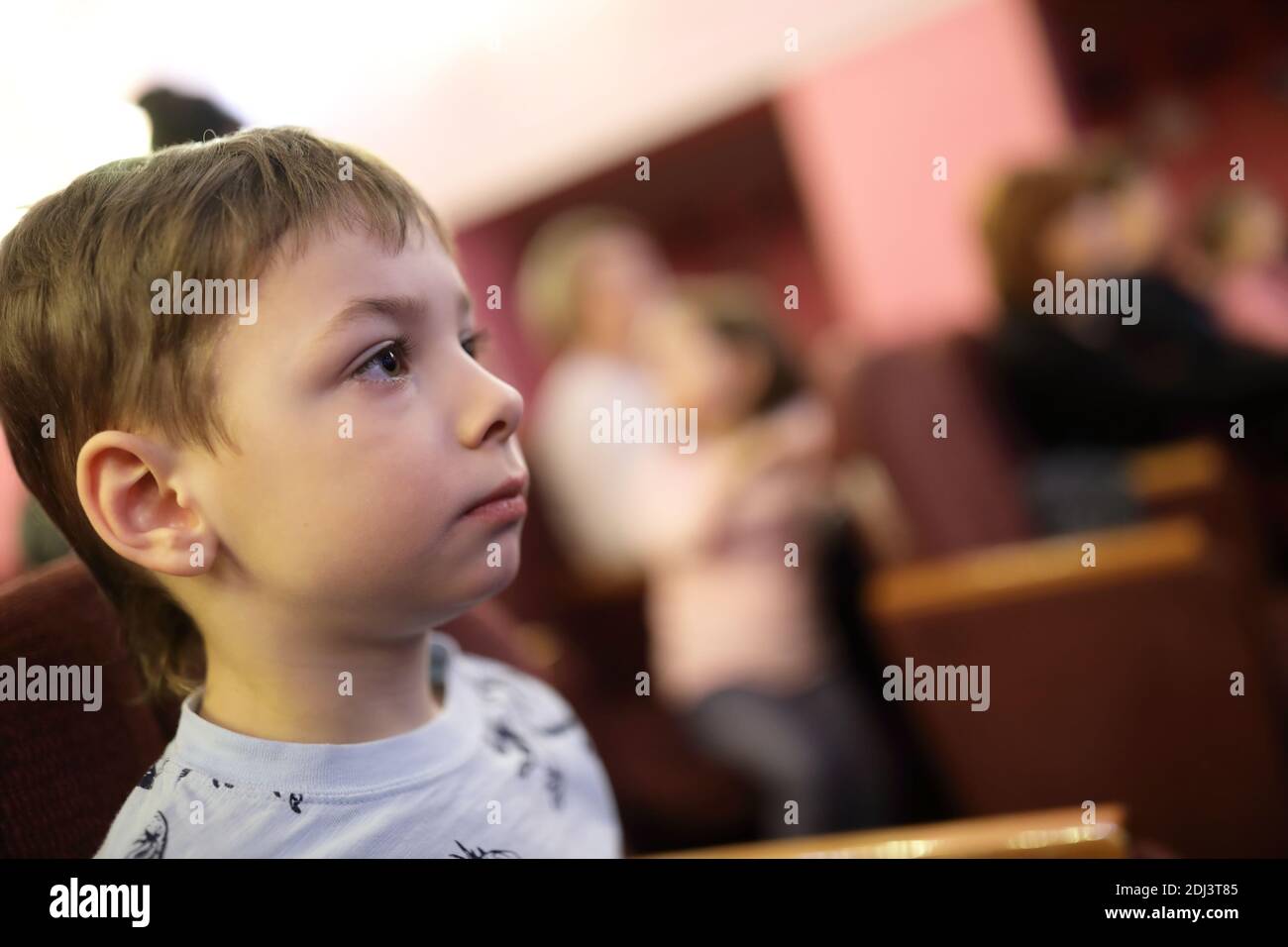 Child watching theatrical performance in the theater Stock Photo - Alamy