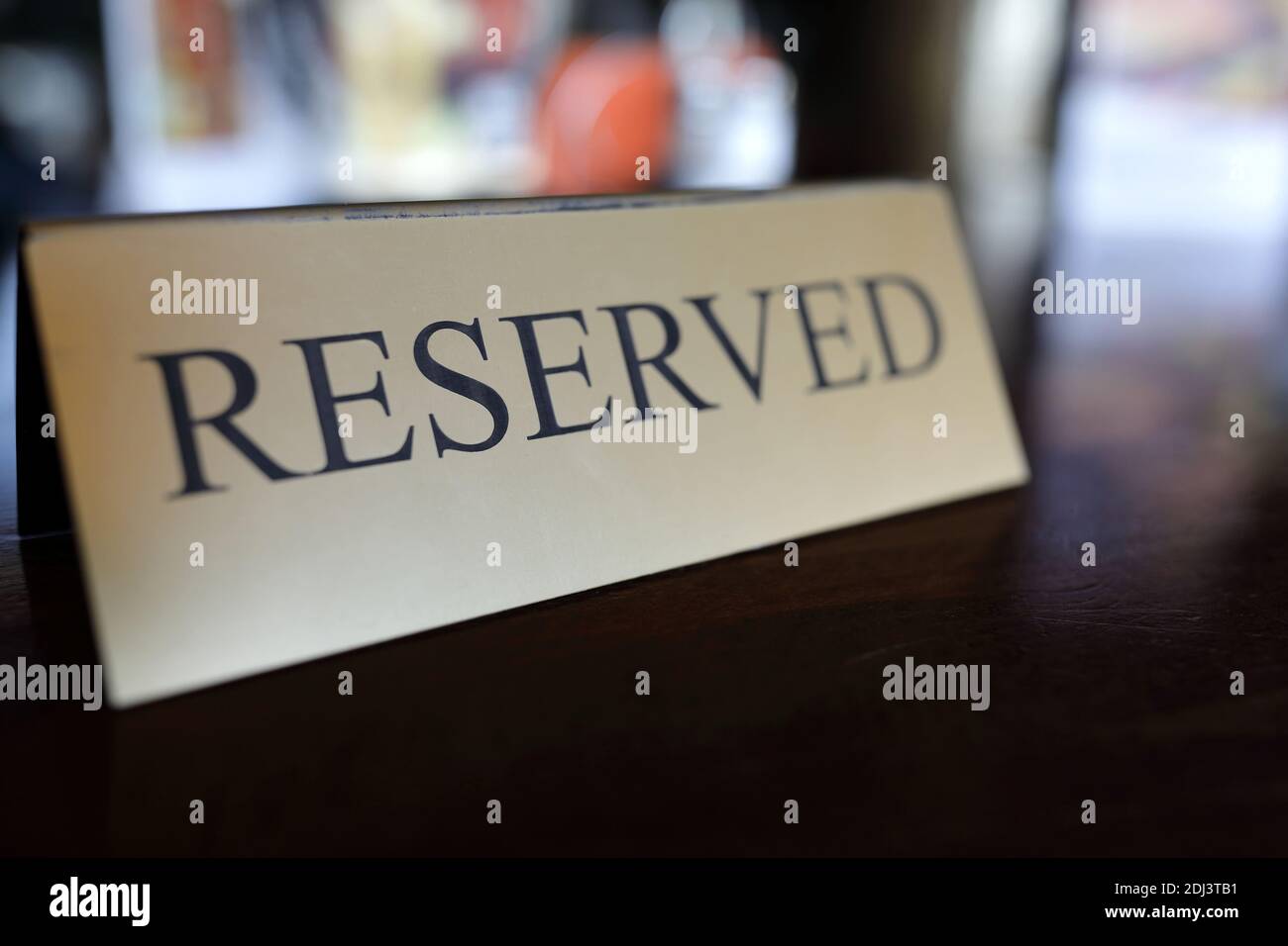 Reserved sign on table in a restaurant Stock Photo - Alamy