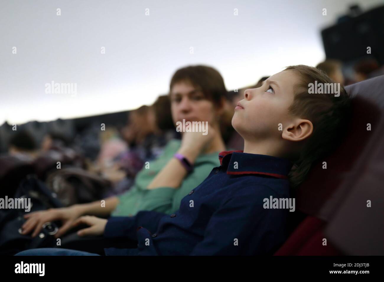 Child cinema watching movie parent hi-res stock photography and images ...