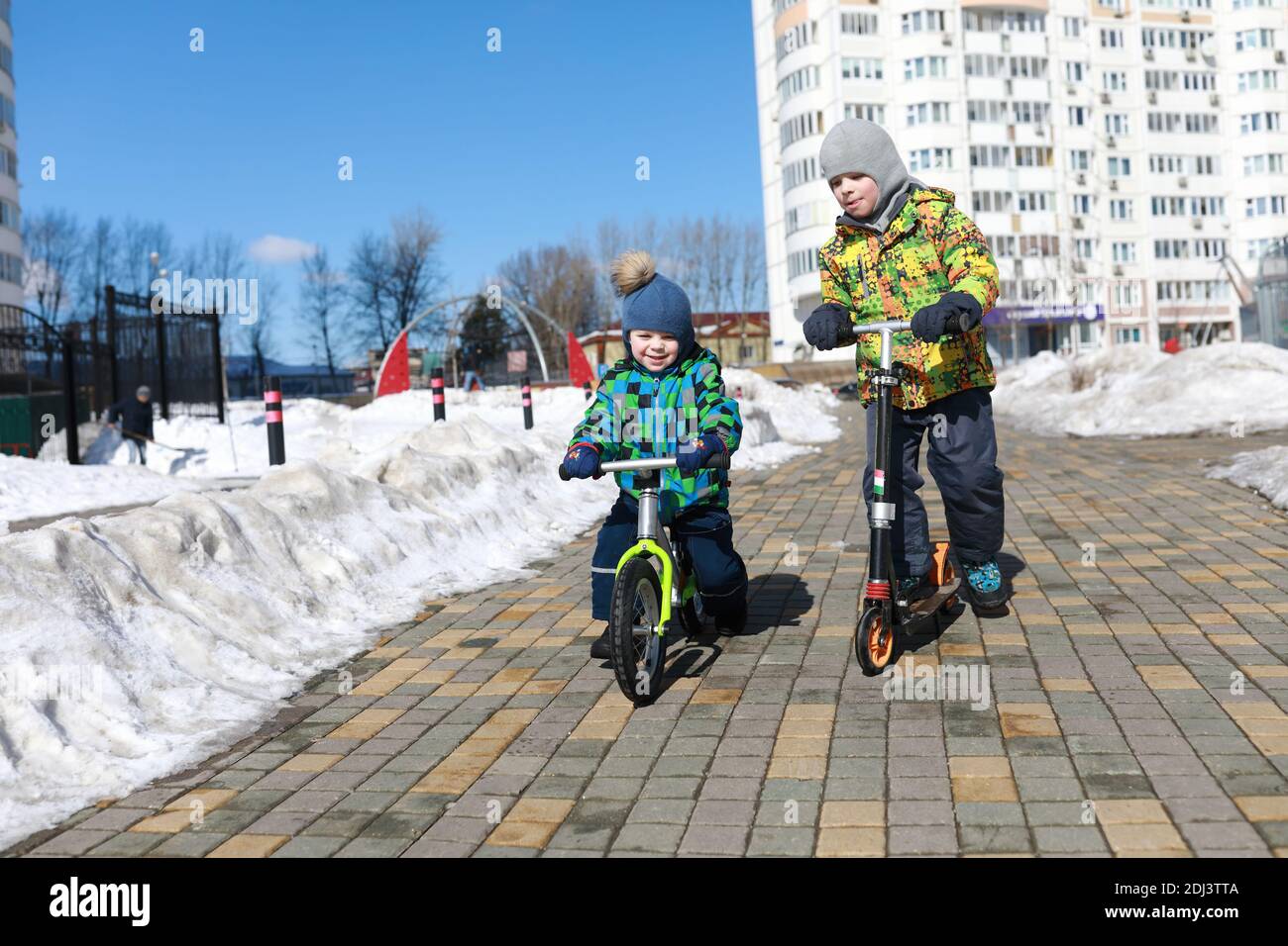 Two boys riding playground hi-res stock photography and images - Alamy