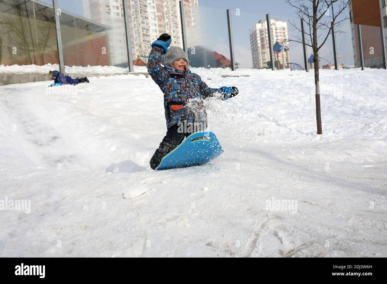 Child kid snow winter roll fun happy hi-res stock photography and ...