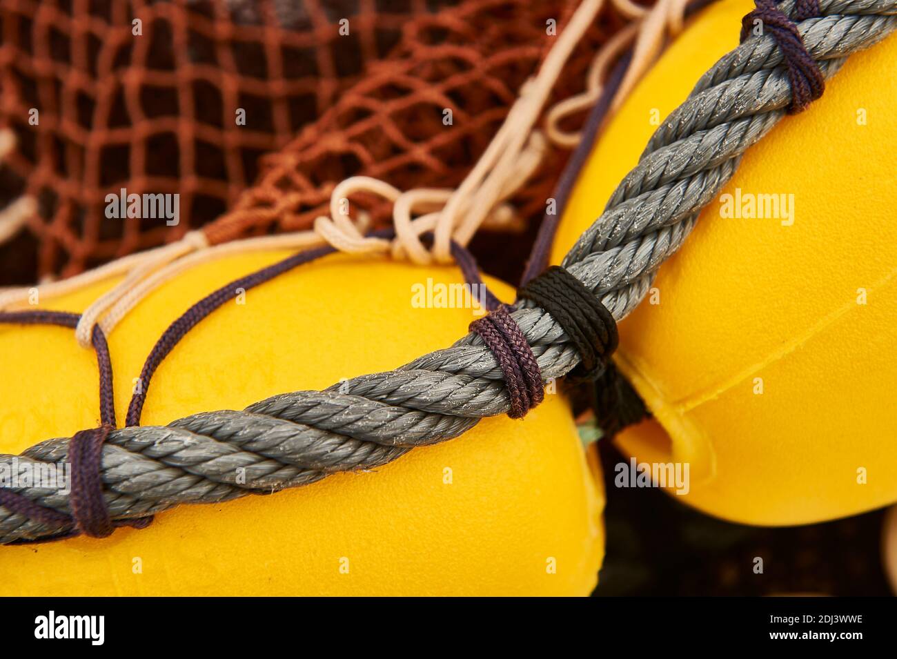 Pile of commercial fishing nets on a fishing quay Stock Photo - Alamy