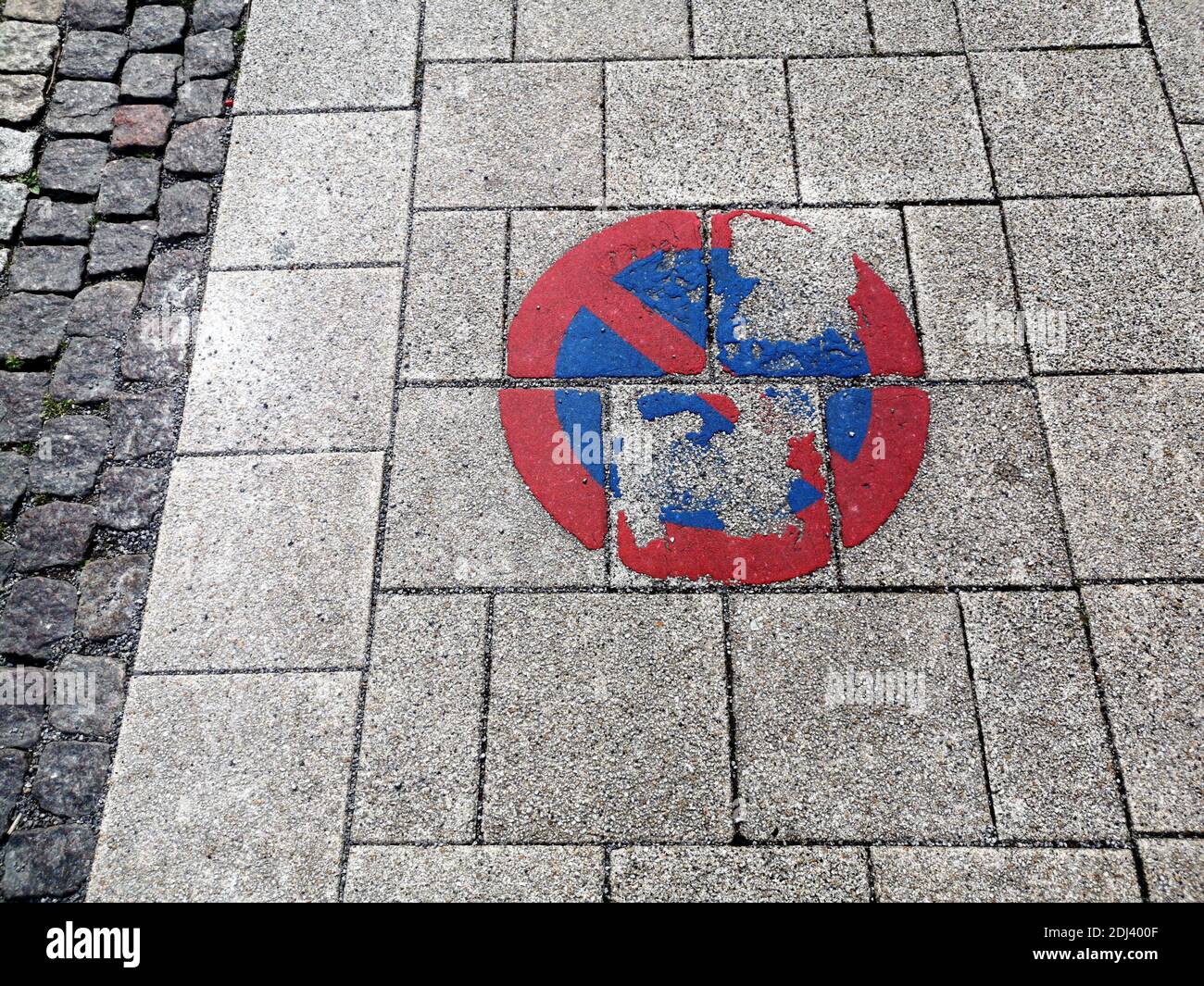A high angle shot of a fading stop sign on the stone Stock Photo - Alamy