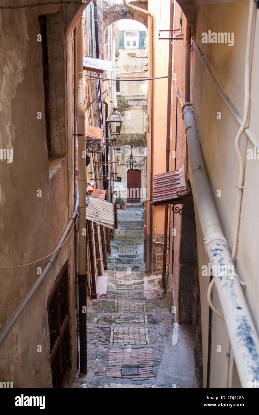 Colorful narrow alley in a traditional Italian village Stock Photo - Alamy