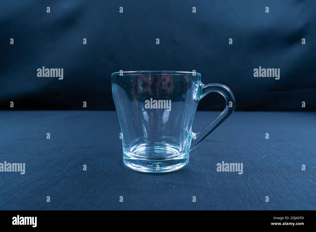 Empty glass on black background with mirroring Stock Photo - Alamy
