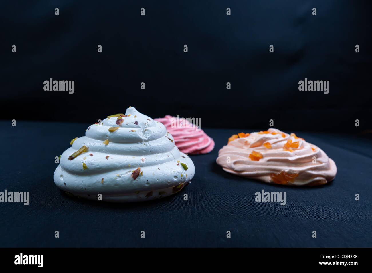 A popular French meringue dessert on a black background. Closeup Stock ...