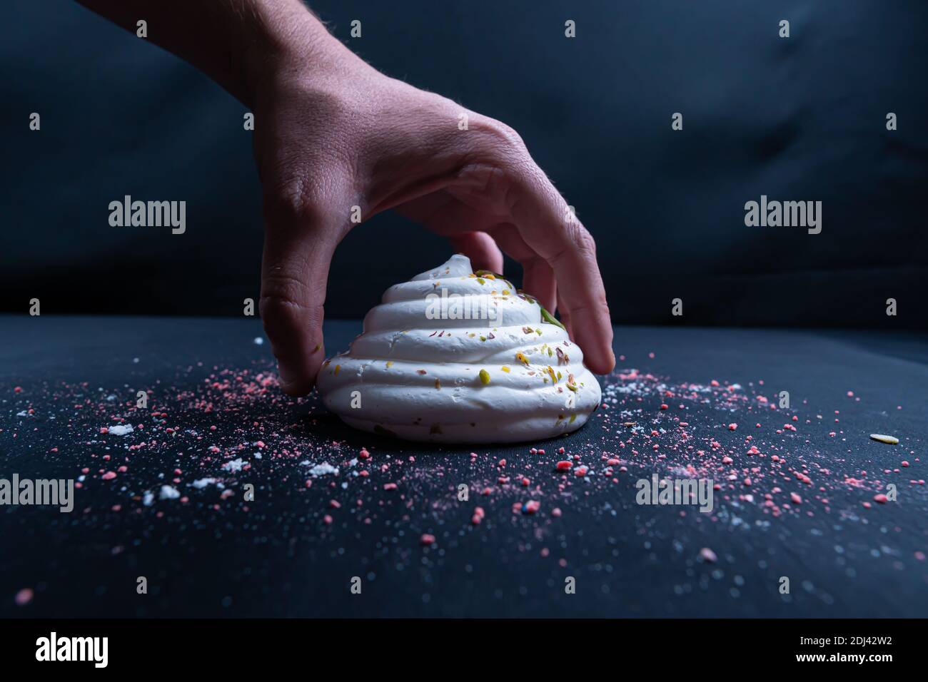 A popular French meringue dessert on a black background. Closeup Stock ...
