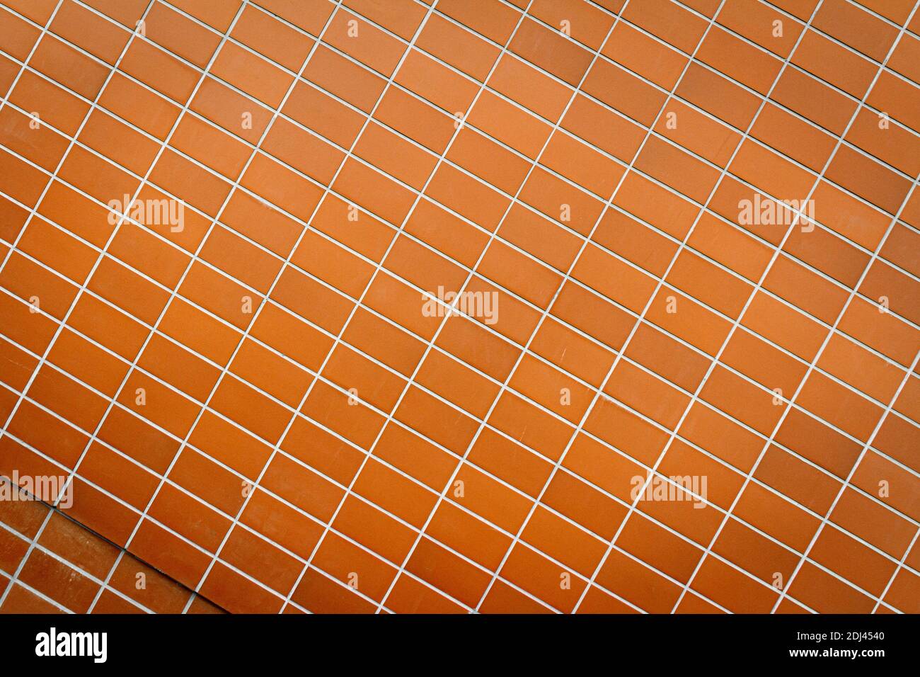 Modern weathered red tile wall texture background Stock Photo - Alamy