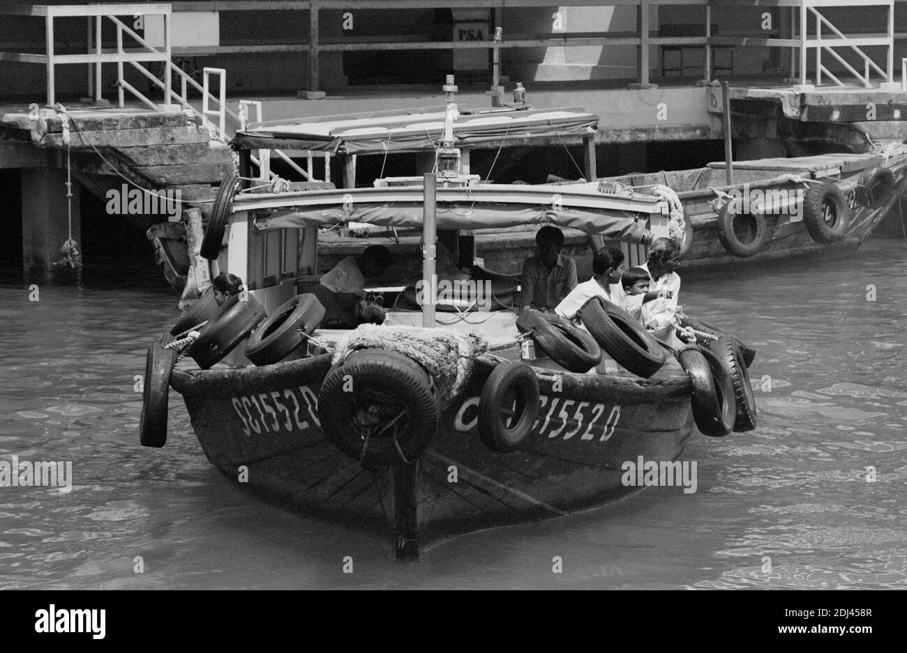 A traditional bum boat in Singapore Harbour. 1987 Stock Photo - Alamy