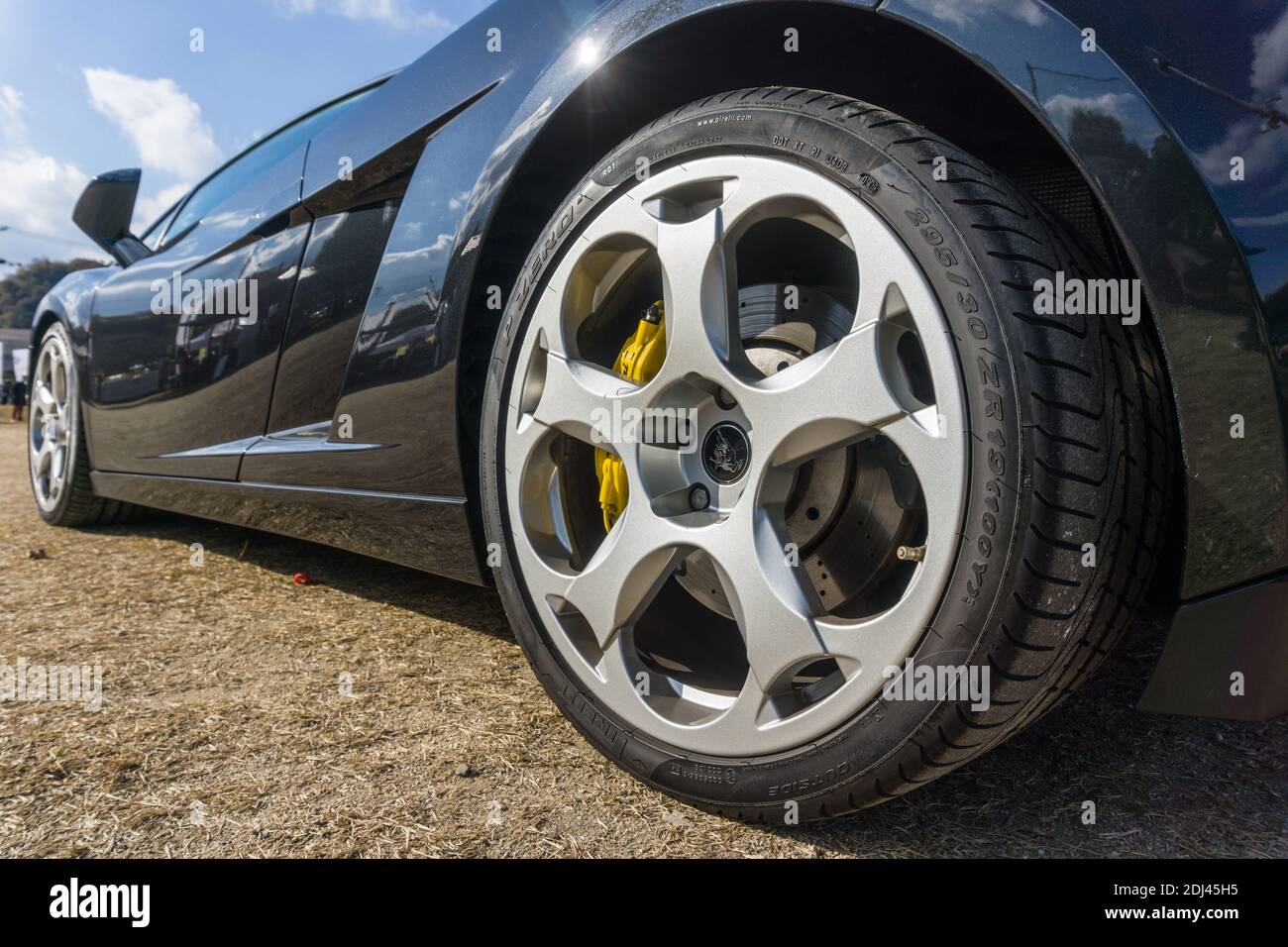 Close up detail of the rear wheel and arch on a metallic black first ...