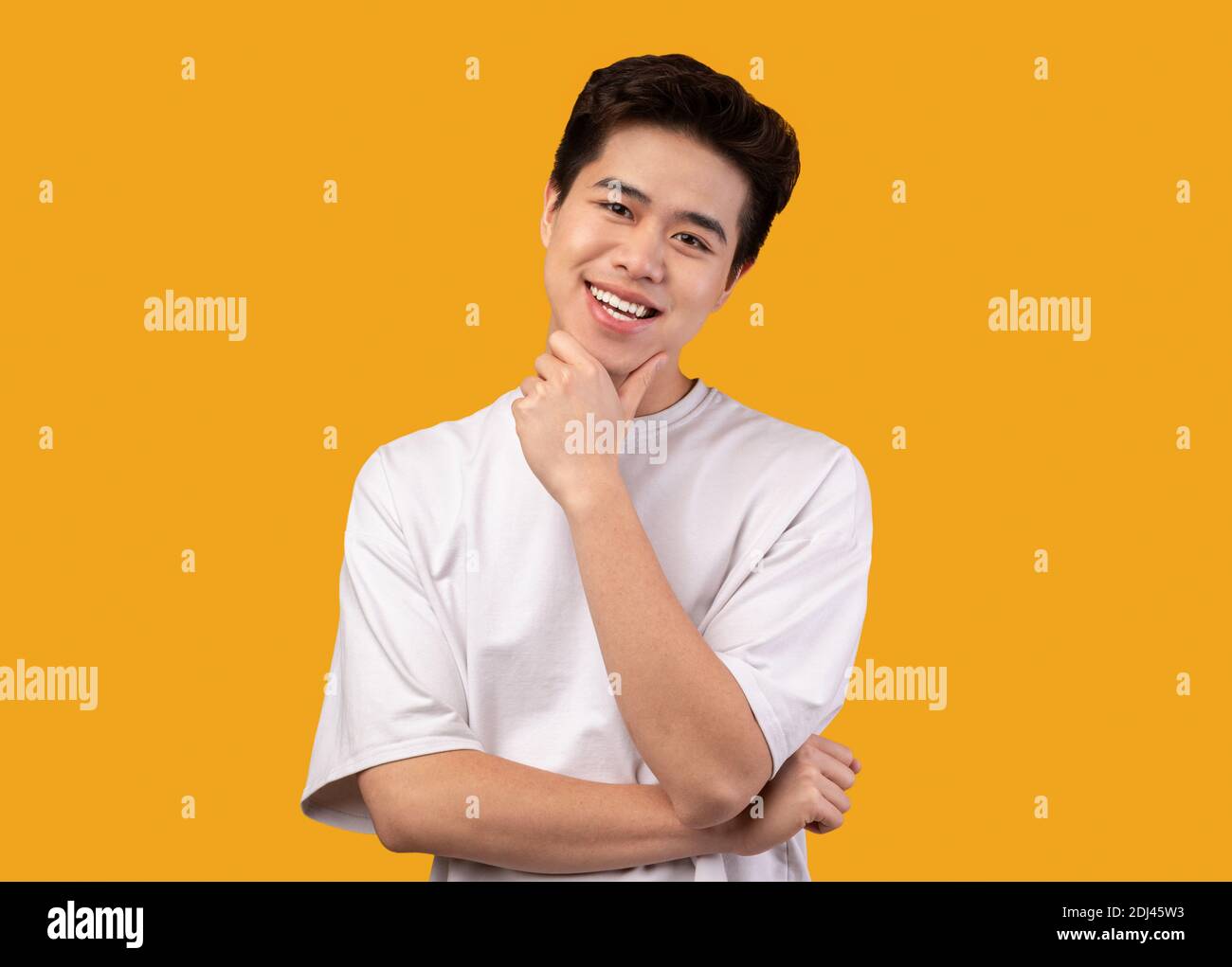 Portrait of attractive asian guy posing at studio Stock Photo - Alamy