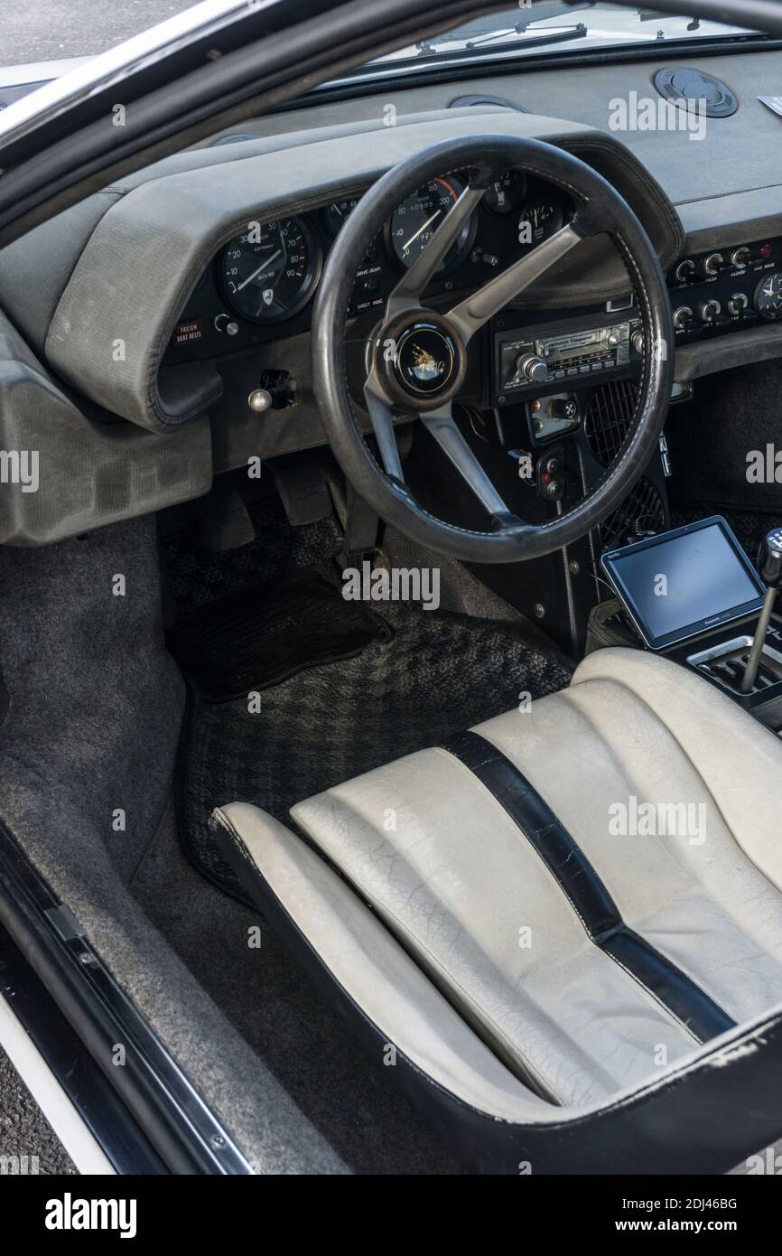 Close up detail of the dark grey interior, dashboard and steering wheel ...