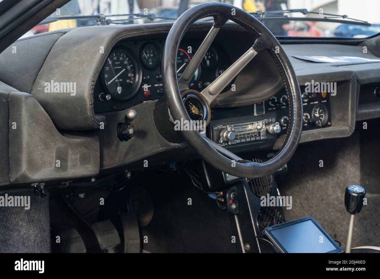 Close up detail of the dark grey interior, dashboard and steering wheel ...