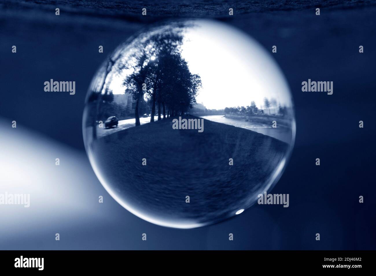 Street view through a lens ball Stock Photo - Alamy