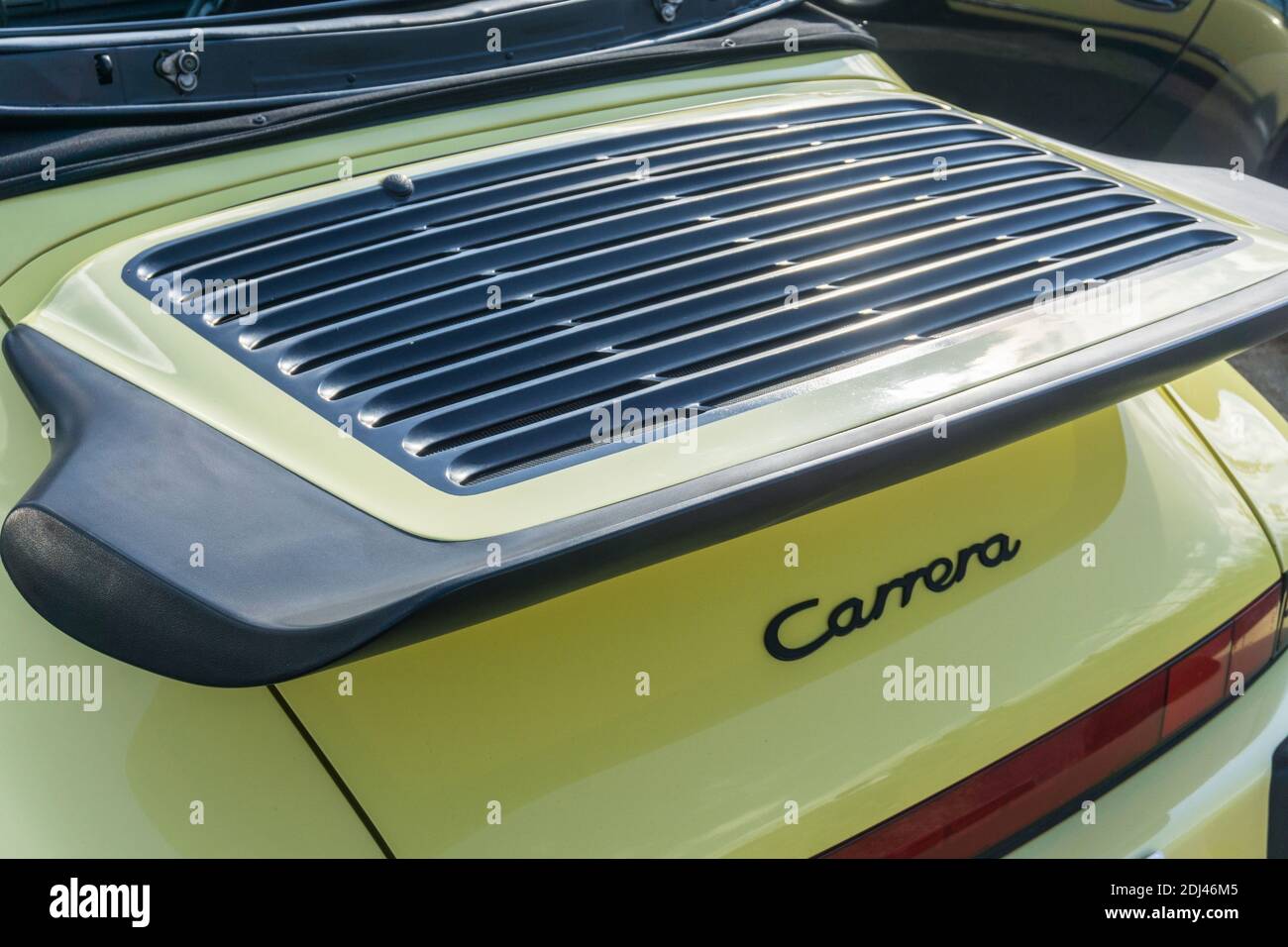 The wing and rear engine cover grille on a yellow eighties Porsche 911 ...