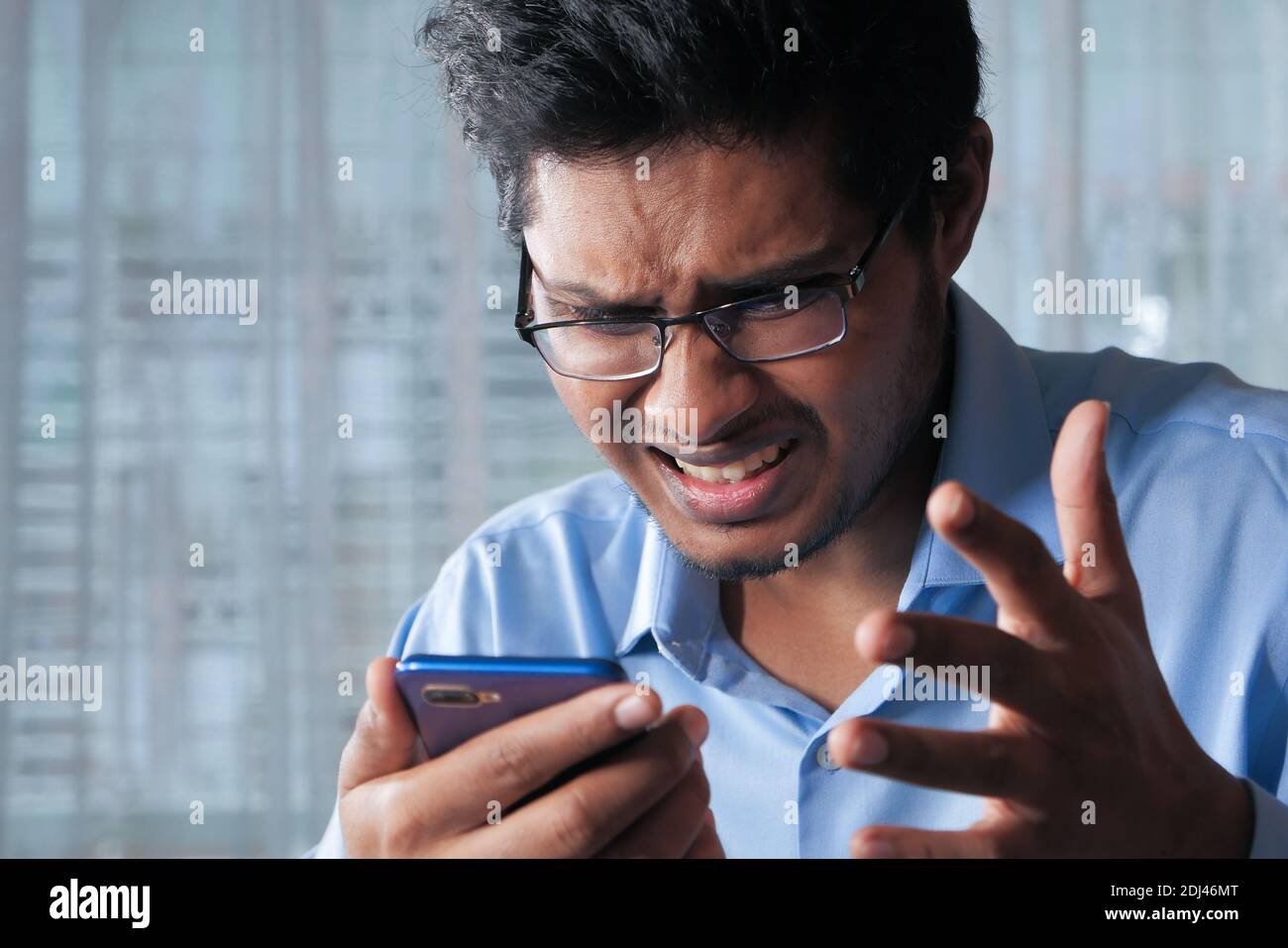 Upset man reading bad news hi-res stock photography and images - Alamy