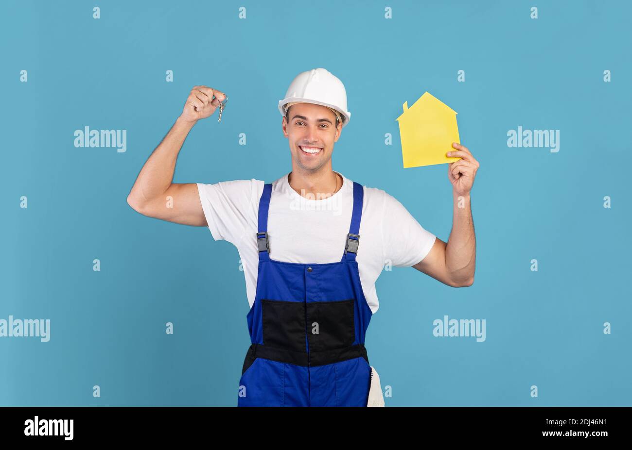 Home Repair. Smiling Handyman In Coveralls Holding Paper House Figure ...
