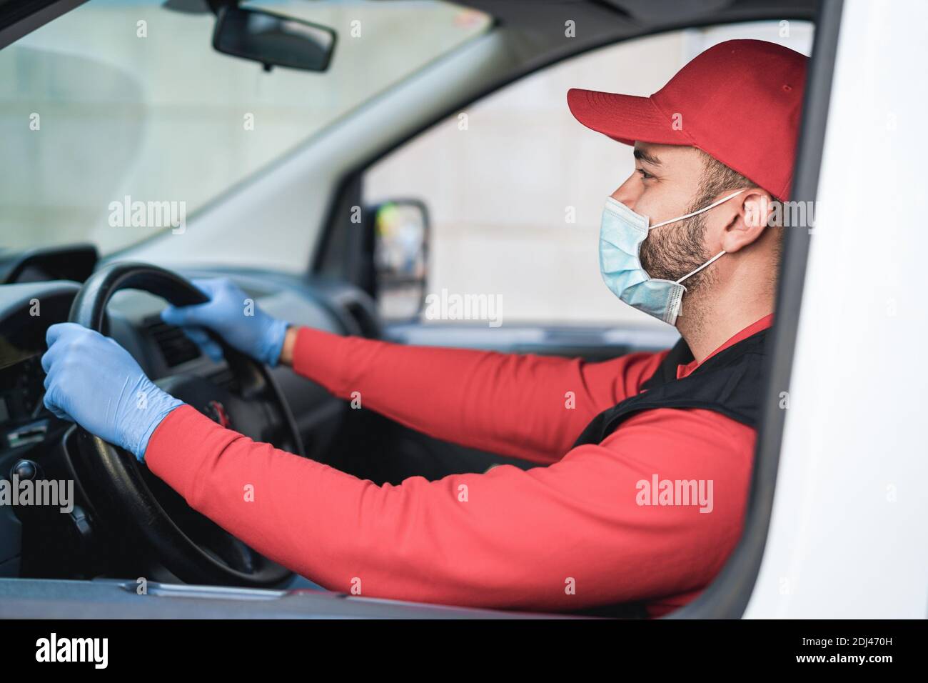 Postal worker driving truck hi-res stock photography and images - Alamy