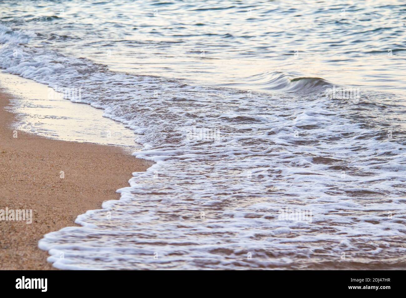 The beach with sea waves running on the sand. Beautiful view on the ...