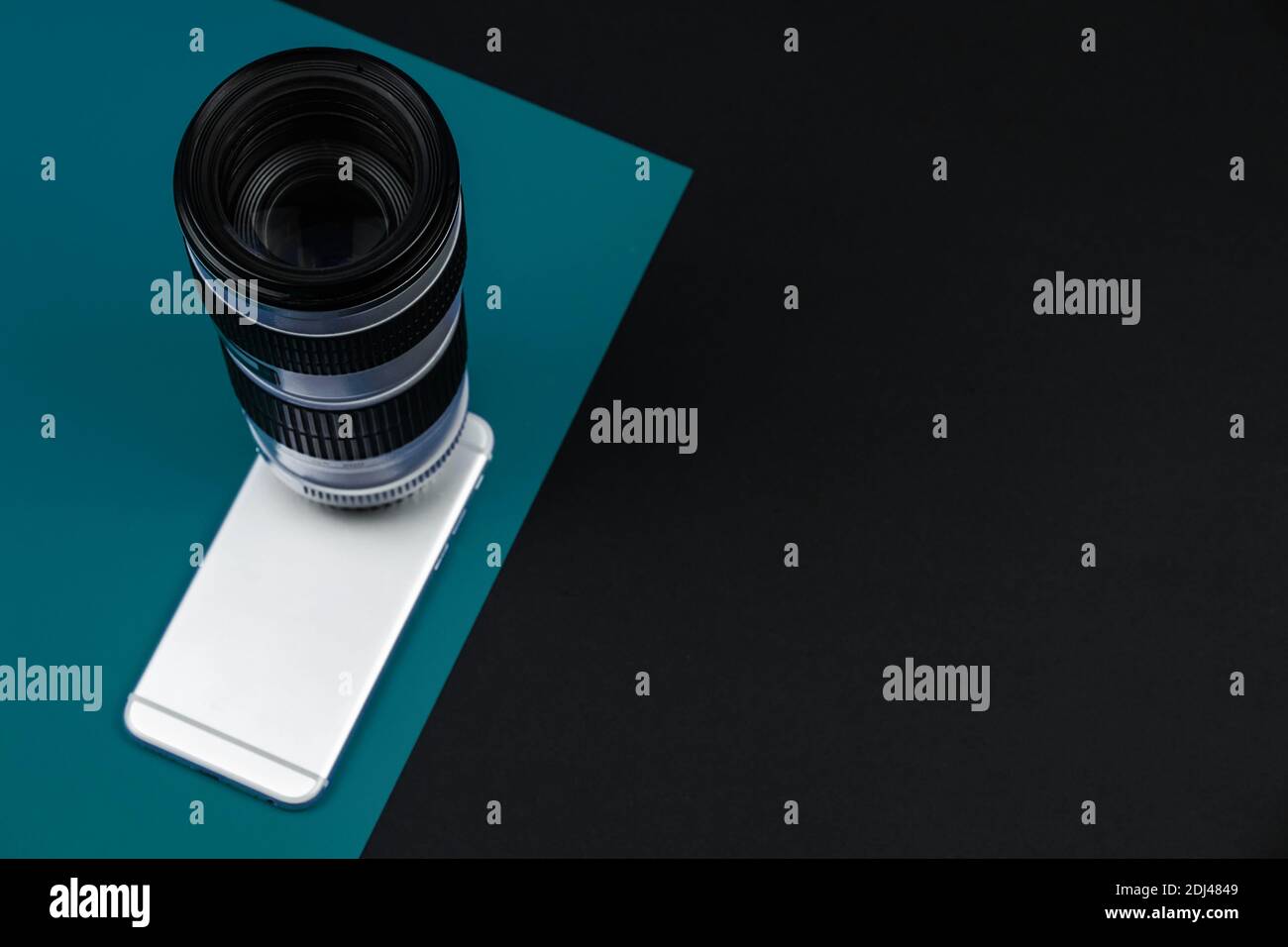 Modern concept, smartphone camera capabilities, DSLR telephoto lens ...