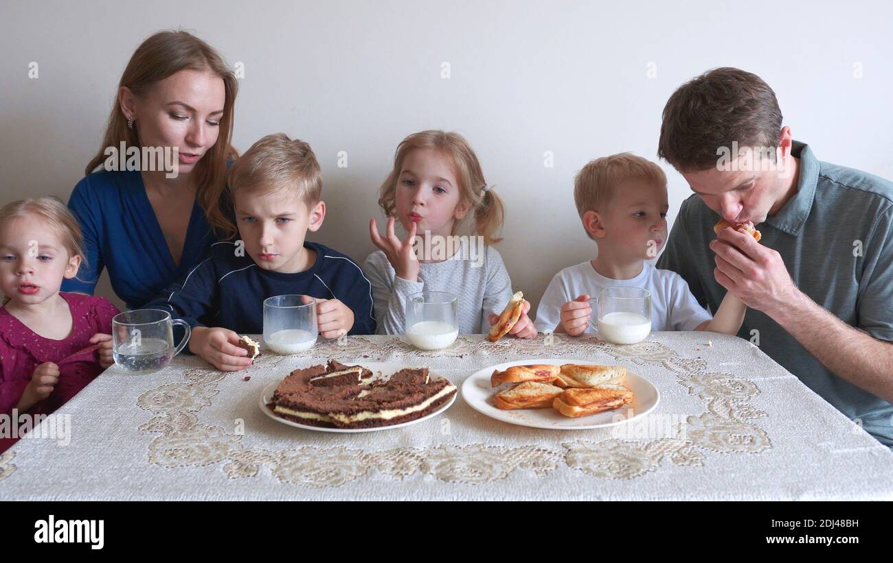 A large and friendly family has lunch at home Stock Photo - Alamy