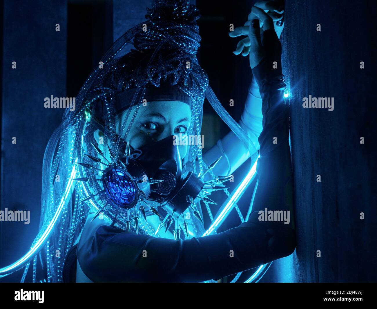 Cosplay girl in a luminous costume at the Cyberpunk Festival.Russian ...
