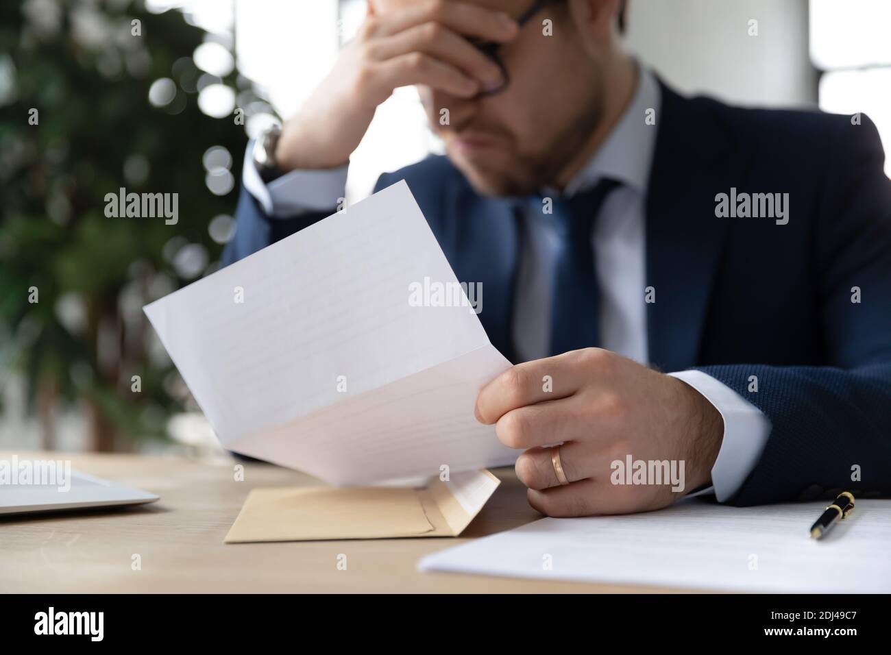 Close up unhappy frustrated businessman holding paper letter Stock ...