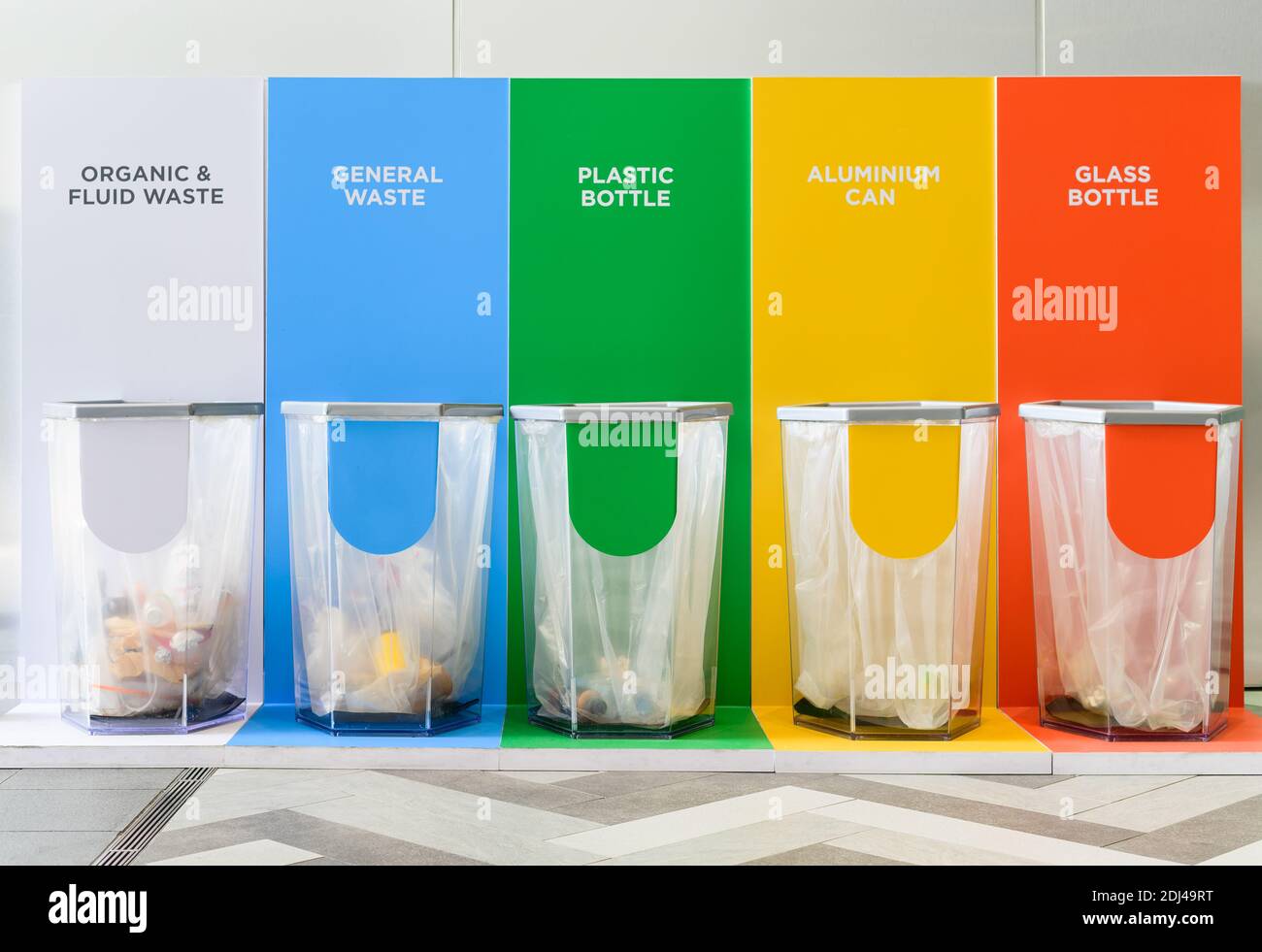 Different colored bins for collection of recycle materials Stock Photo ...