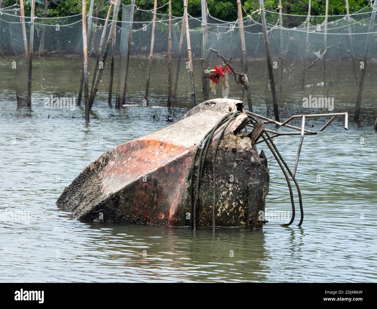 Wreck of overgrown plastic speedboat, sunken at shallow waters Stock ...
