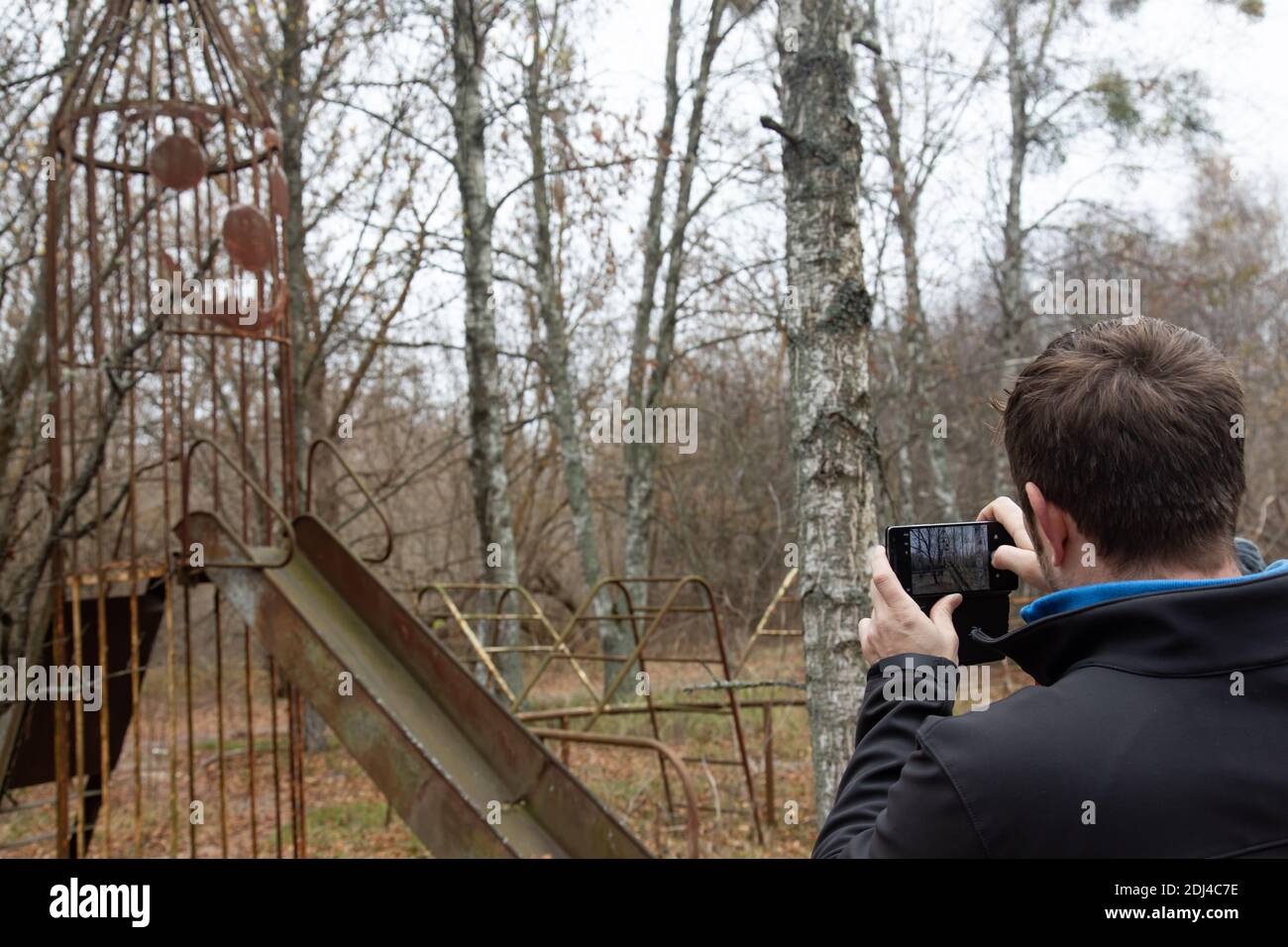 Pripyat, Chernobyl exclusion area, Ukraine - November 3, 2019: a guy ...