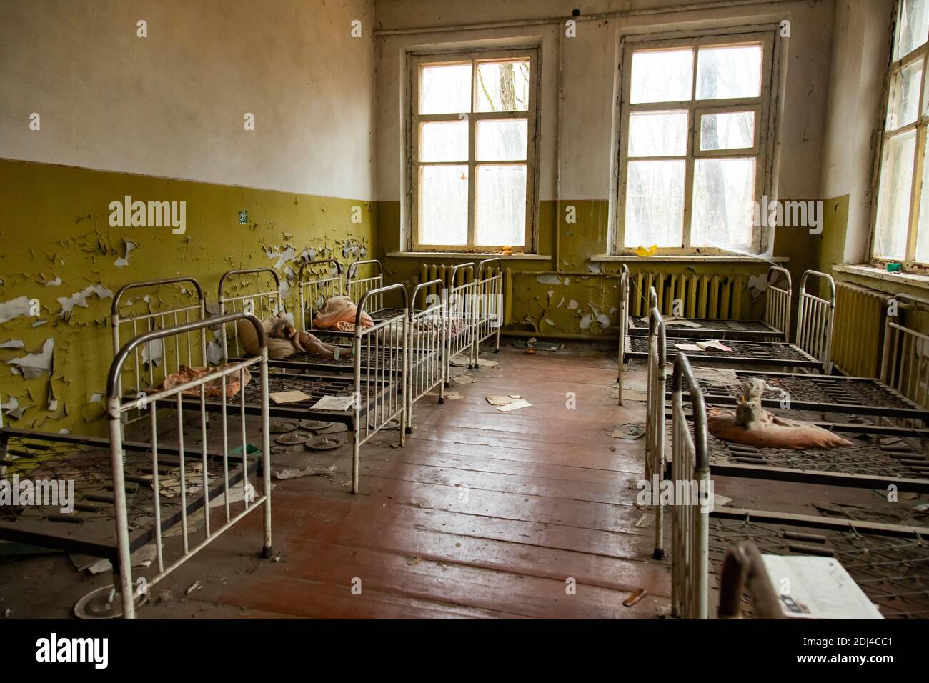 Scary dolls on beds in the kindergarten, a structure for children and a ...